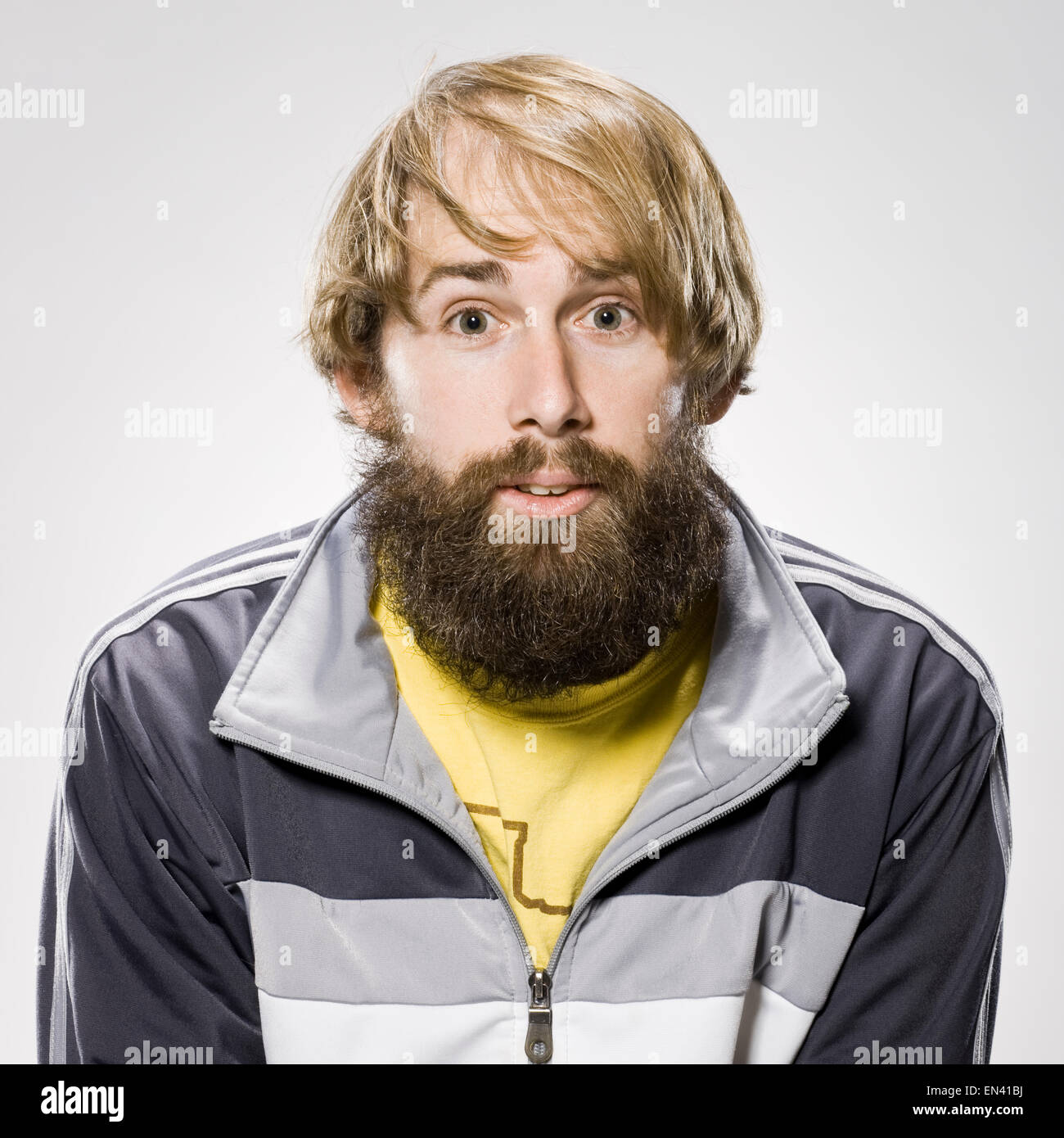man with a beard wearing a track jacket Stock Photo - Alamy