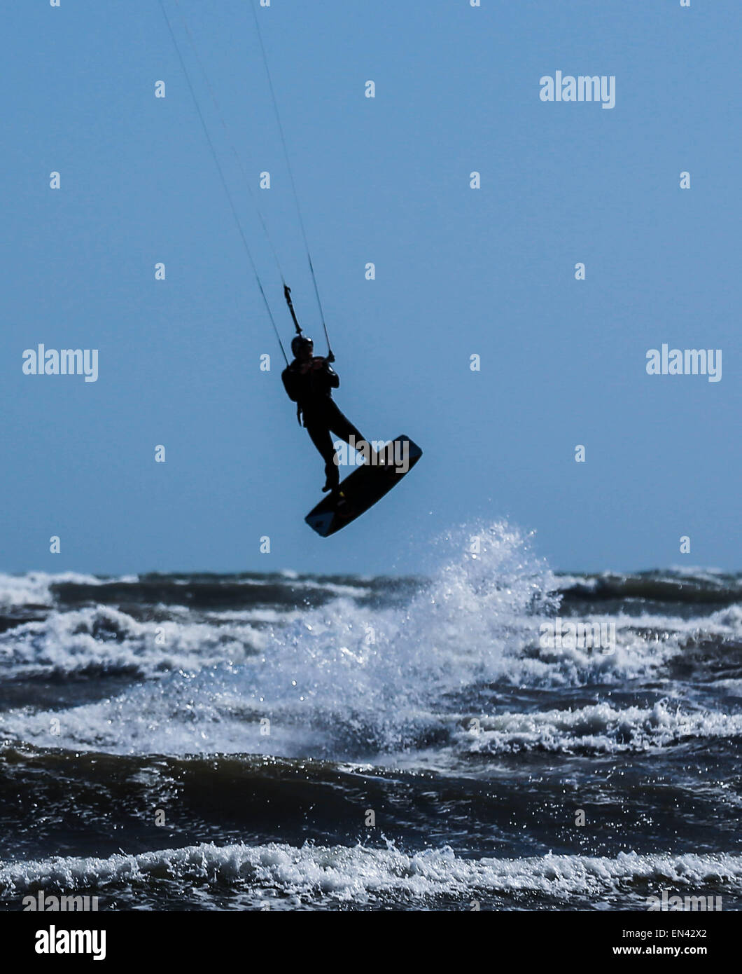 Kite surfer in silhouette jumping in Torbay Devon Stock Photo - Alamy