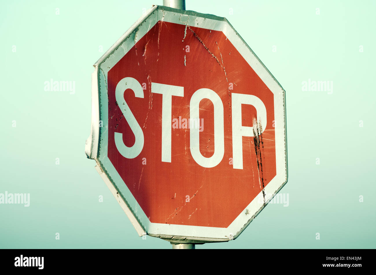 Old rusty stop sign in retro paste color filter Stock Photo - Alamy