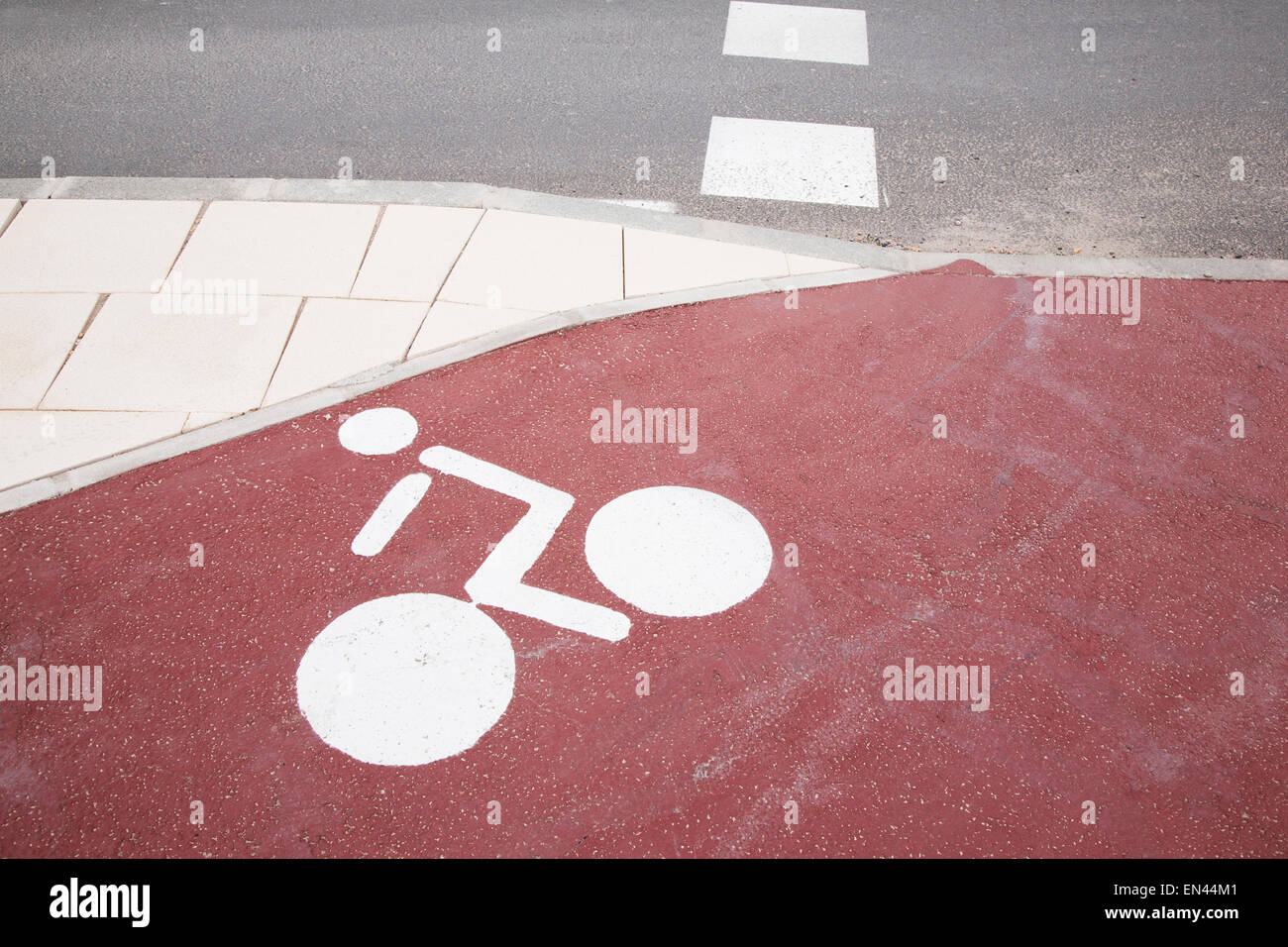 White Bike Lane Symbol in Urban Setting Stock Photo - Alamy