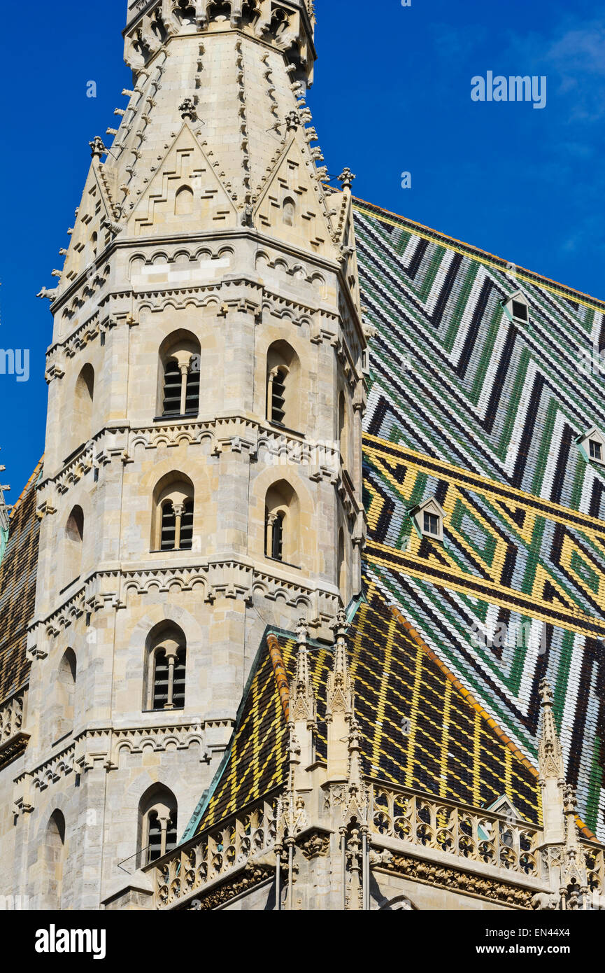The Gothic tower and colorful mosaic tiles decorations on the roof of ...