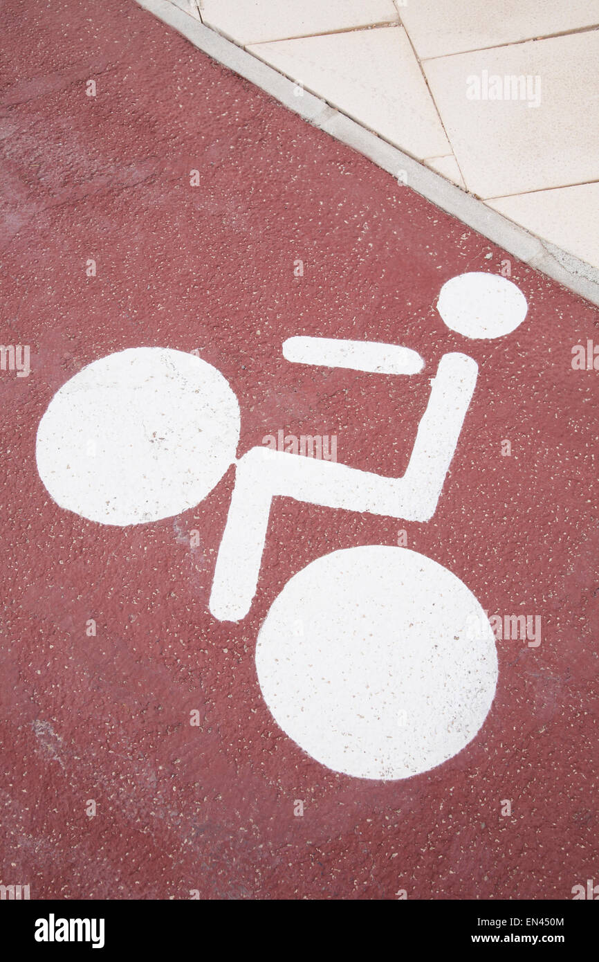 White Bike Lane Symbol in Urban Setting Stock Photo - Alamy