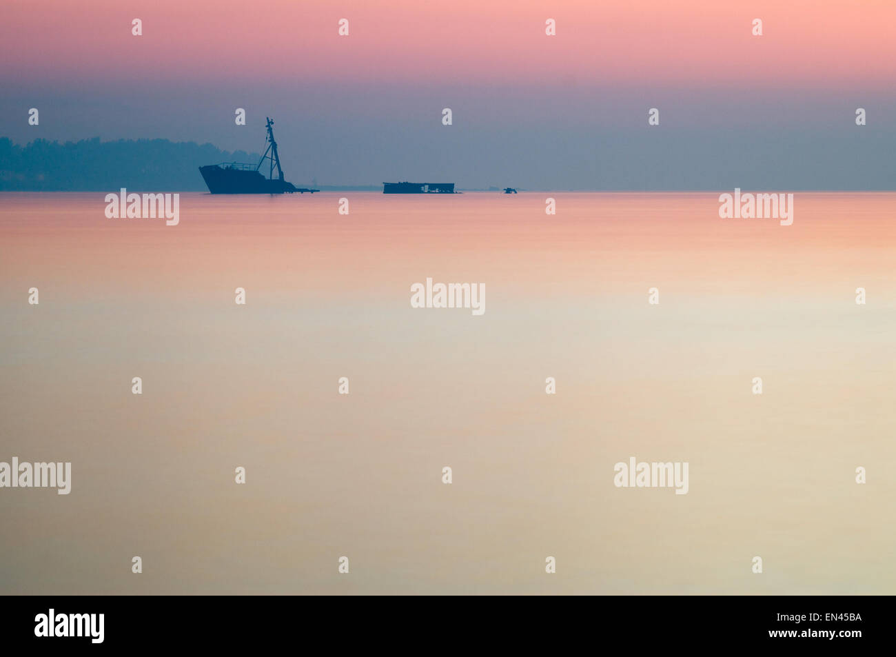 Shipwreck at night, partially sunken old barge Stock Photo - Alamy