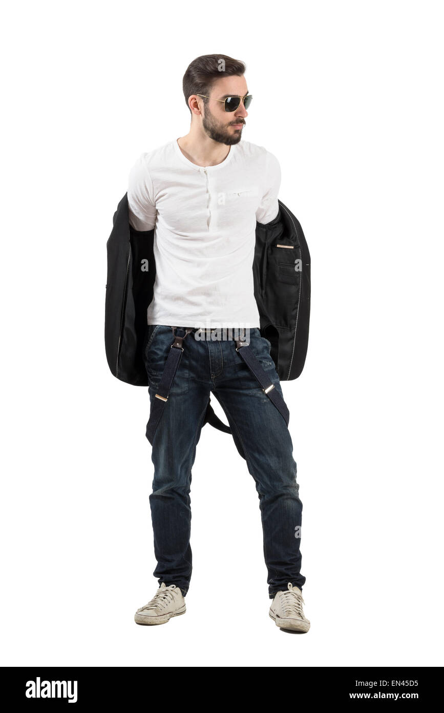 Handsome young man taking off jacket. Full body length portrait ...