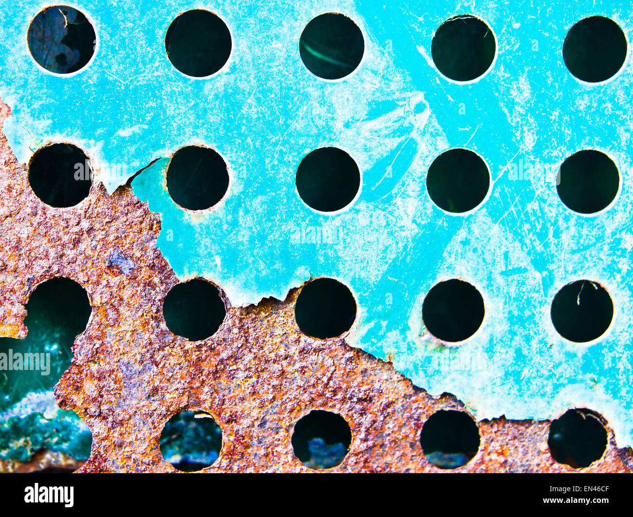 A fenestrated blue metal sheet with rust corrosion Stock Photo - Alamy