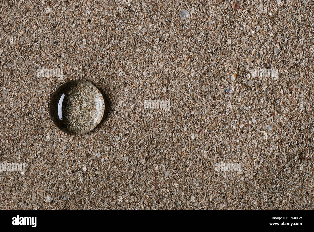 drops of water on the sand photographed close up Stock Photo - Alamy