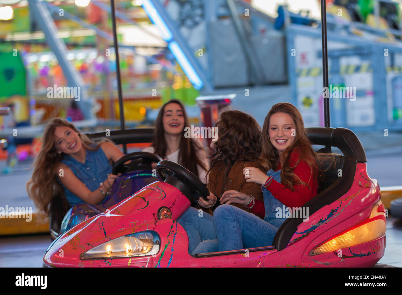group of kids on ride at funfair or fairground Stock Photo - Alamy