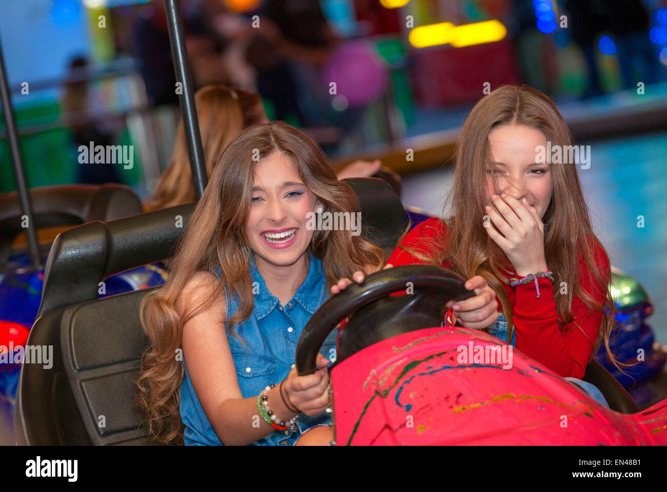 teens at fun fair riding dodgems or bumper cars Stock Photo - Alamy