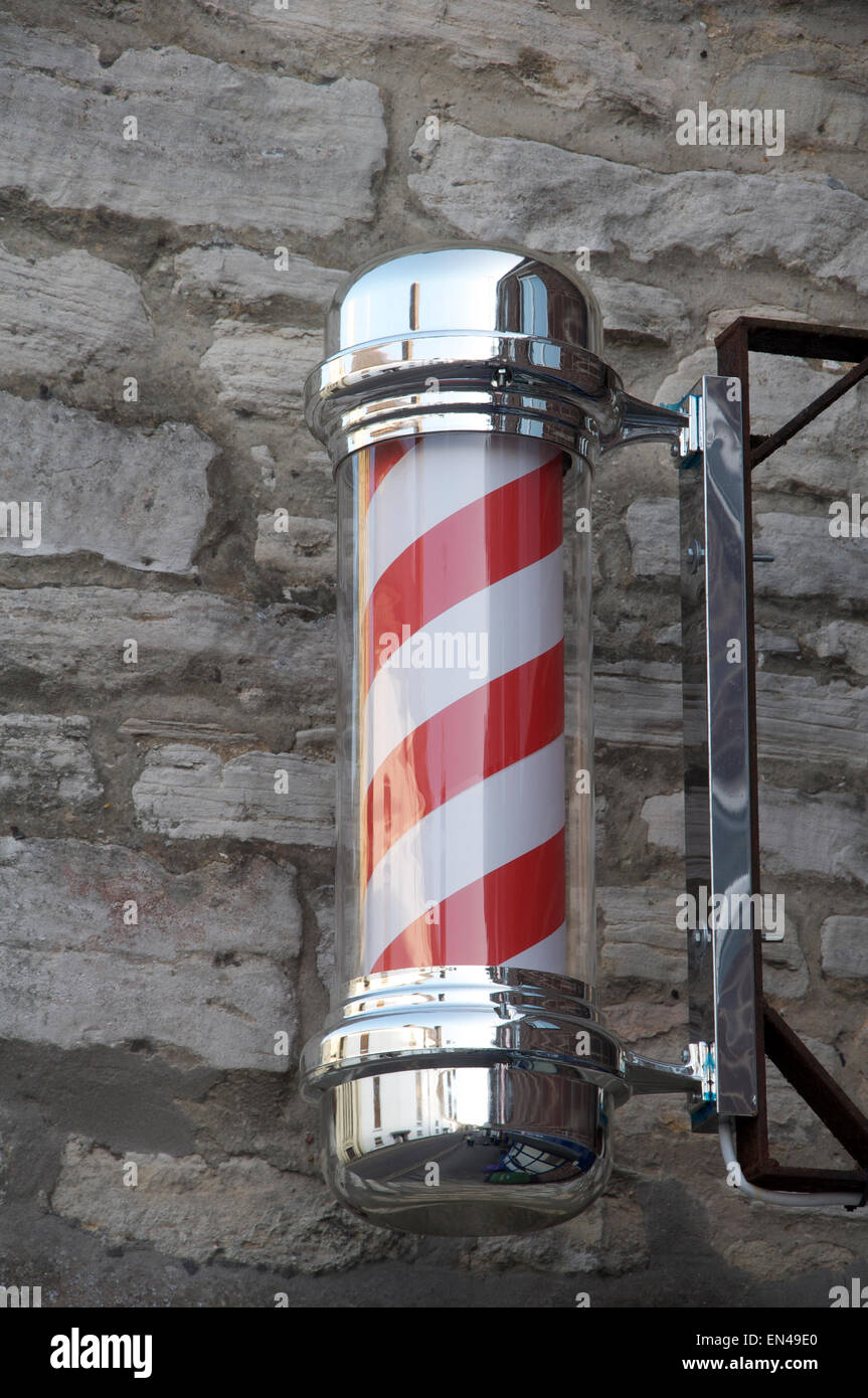 The red and white striped helix of a traditional barbers pole. Fixed to ...