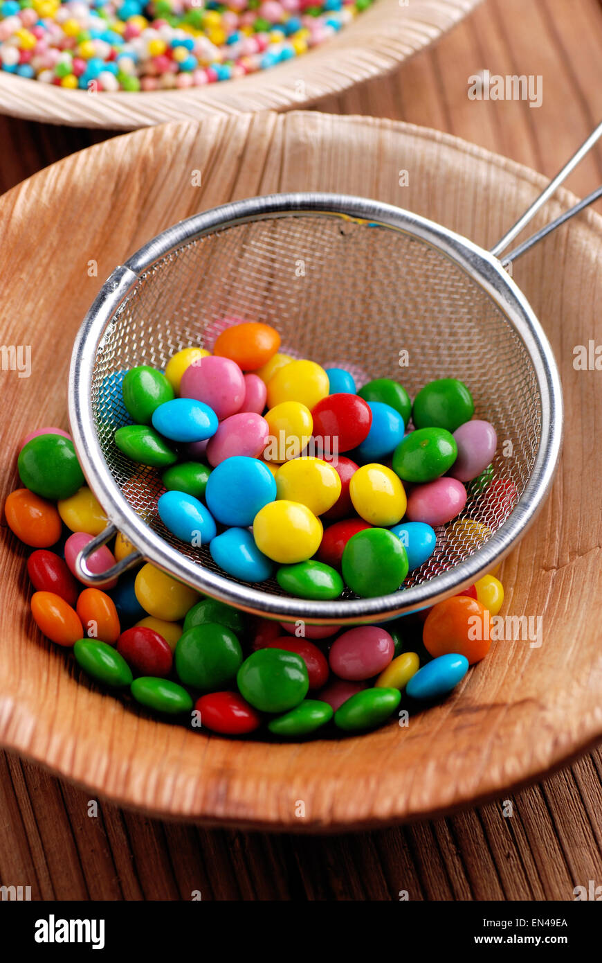 colorful smarties in metal colander Stock Photo - Alamy