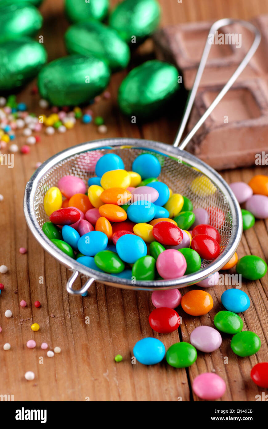 colorful smarties in metal colander Stock Photo - Alamy