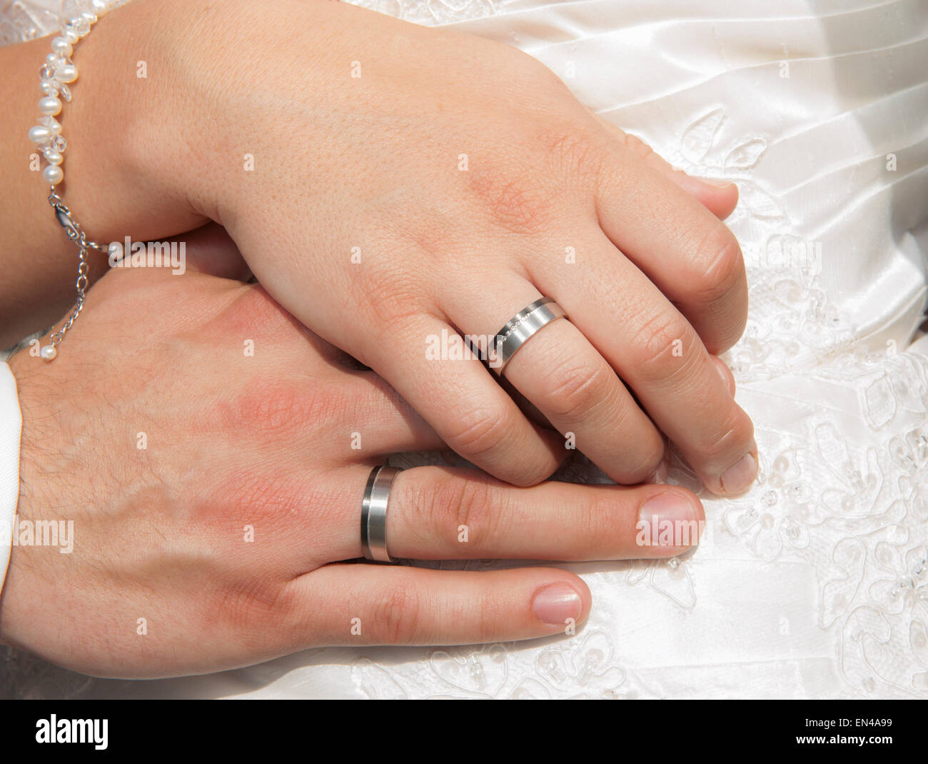 Hands of a bride and groom at a wedding ceremony showing rings Stock ...
