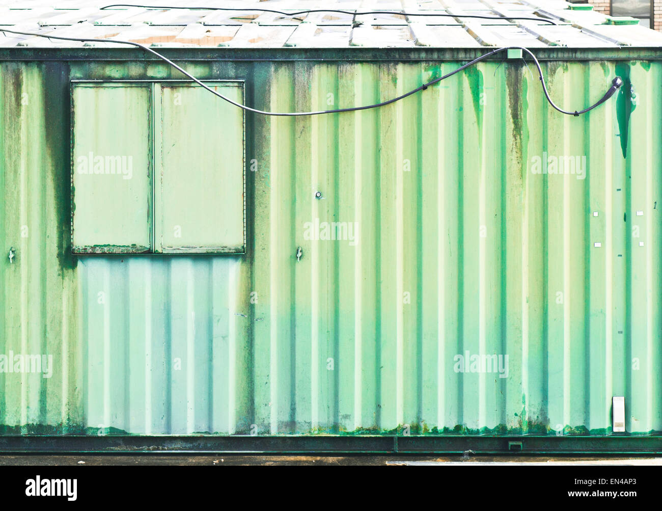 Rusty green corrugated metal on the exterior of an industrial building ...