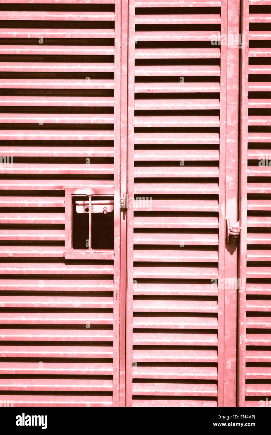 A heavy duty metal gate as a background image Stock Photo - Alamy
