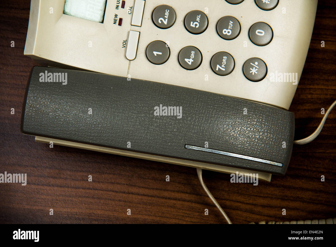 A home phone on a wood background Stock Photo - Alamy