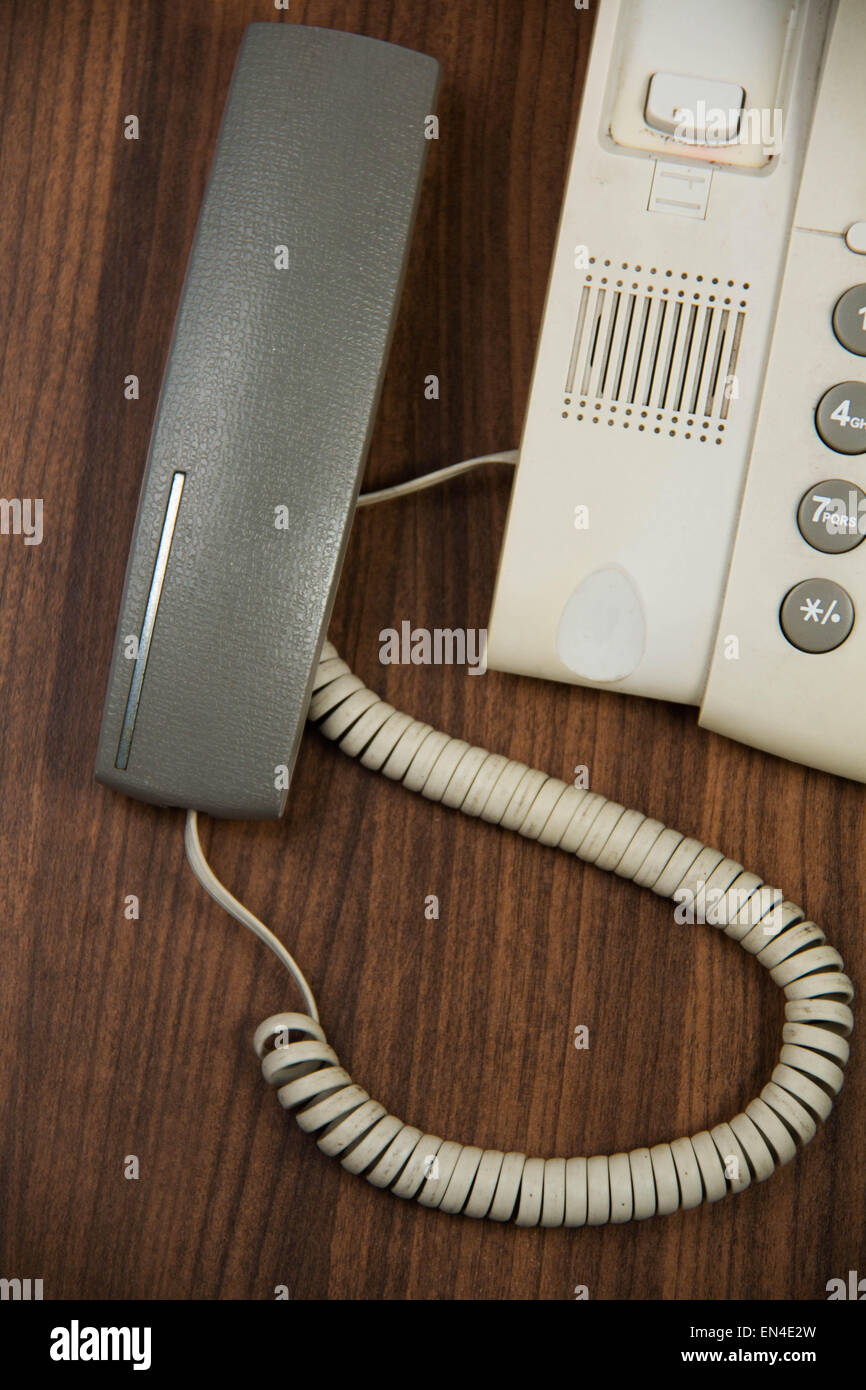 A home phone on a wood background Stock Photo - Alamy