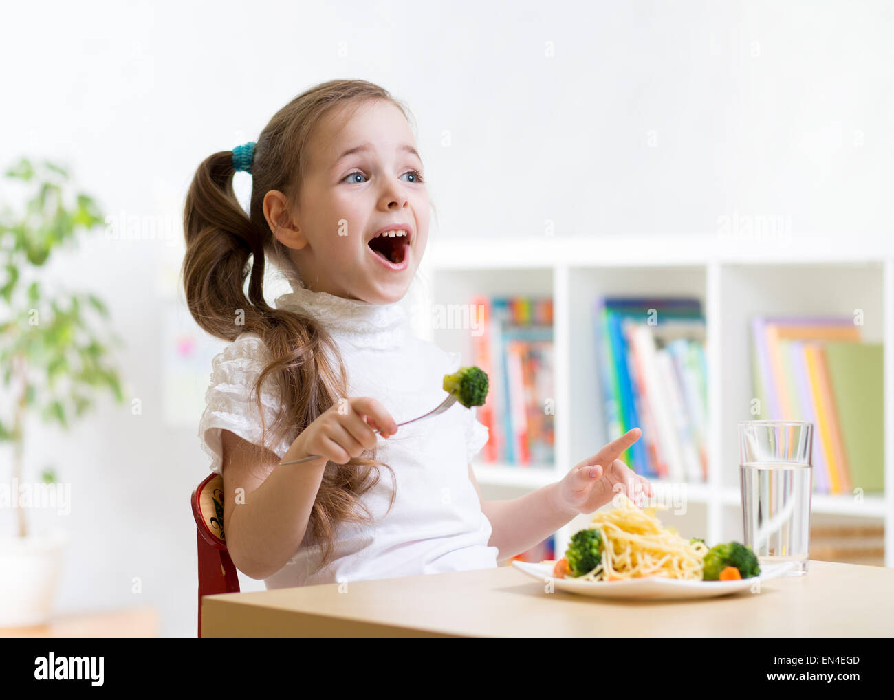 kid eating healthy food at home or kindergarten Stock Photo - Alamy