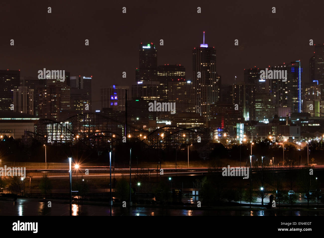 A section of the downtown skyline in Denver, Colorado, on a rainy night ...