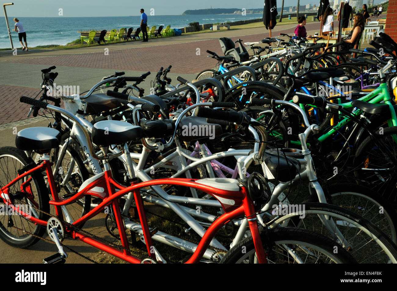 Collection of bicycles for hire by tourists parked close together at ...