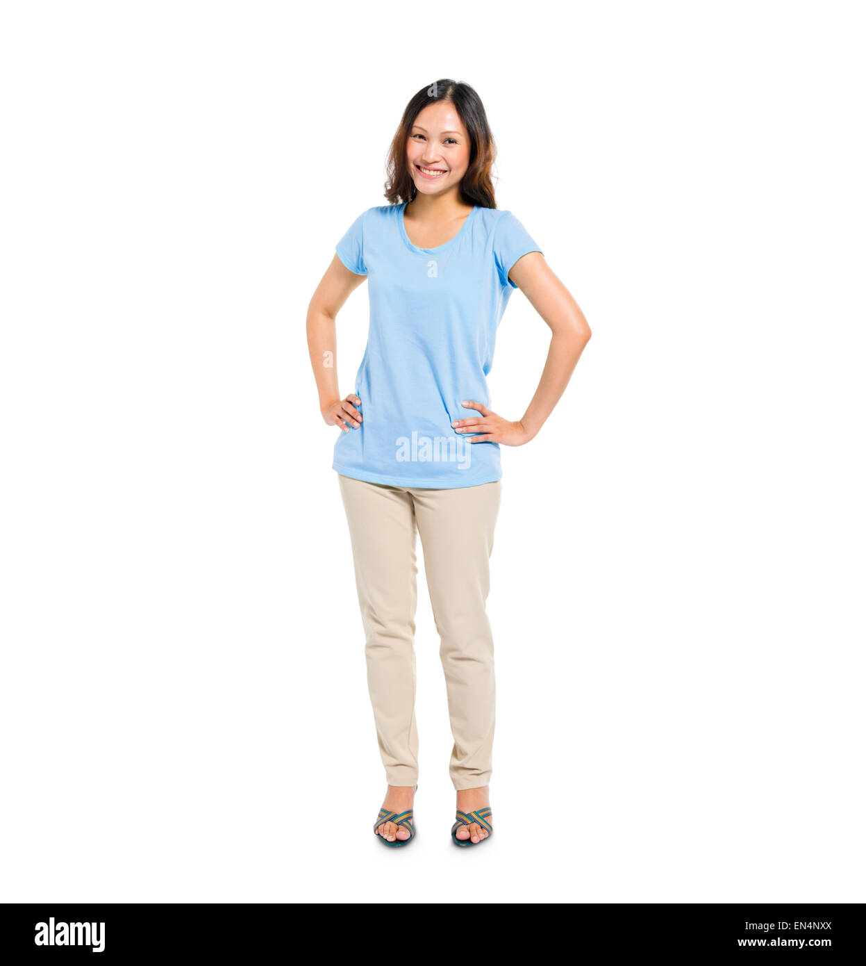 Confident Young Woman Standing and Smiling Stock Photo - Alamy