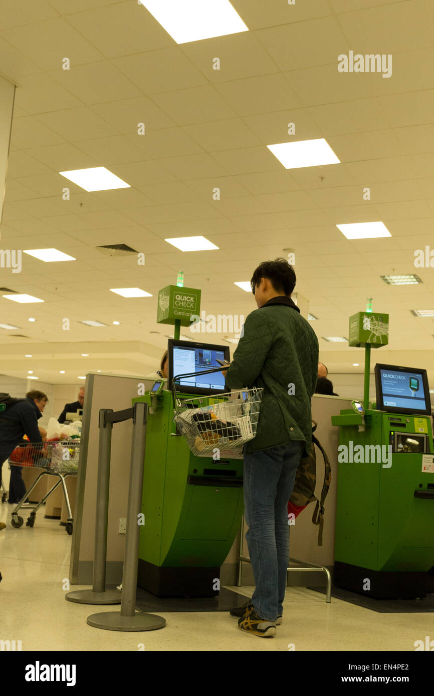 Customers using a Waitrose self service check out counter Stock Photo ...