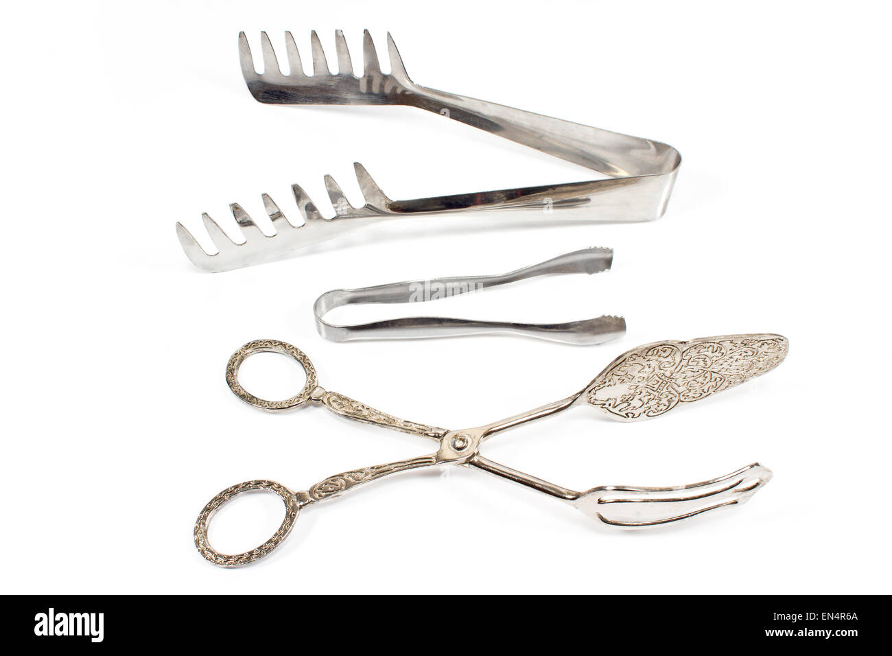 Set of various tongs isolated on a white Stock Photo - Alamy