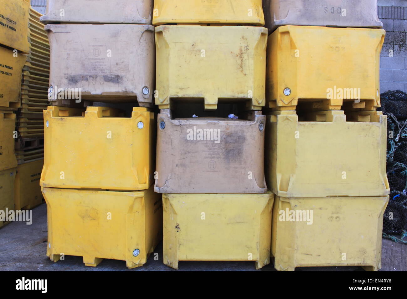 fish boxes stacked in newlyn harbour Stock Photo - Alamy
