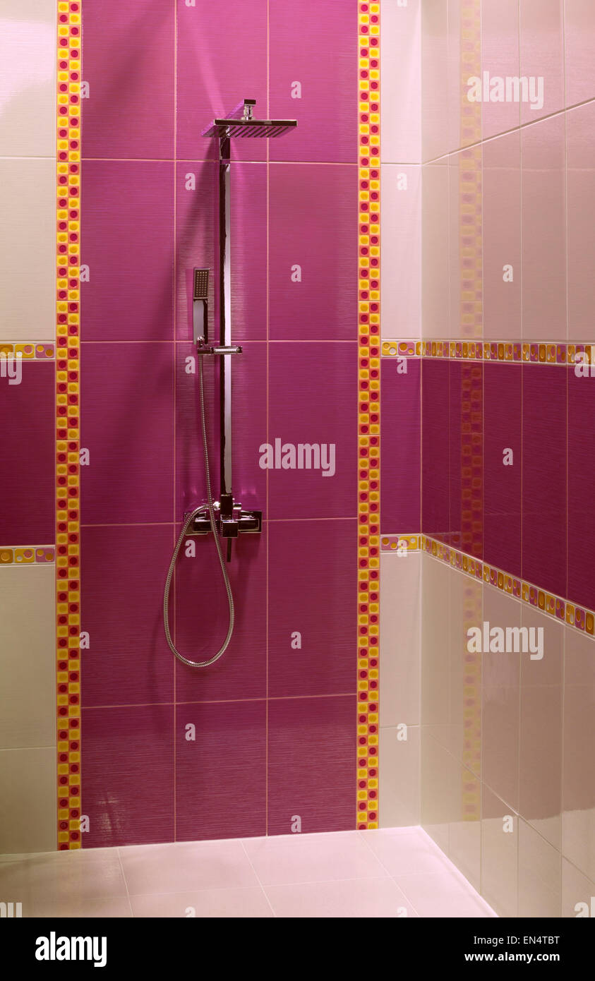 detail of the shower and shower with pink and red tiles for bathroom ...