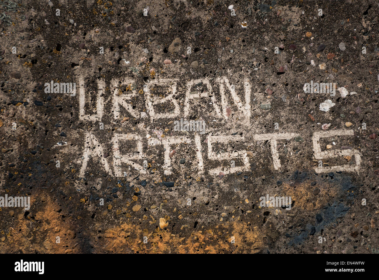 Scratched "urban artists" graffiti on a concrete wall Stock Photo - Alamy