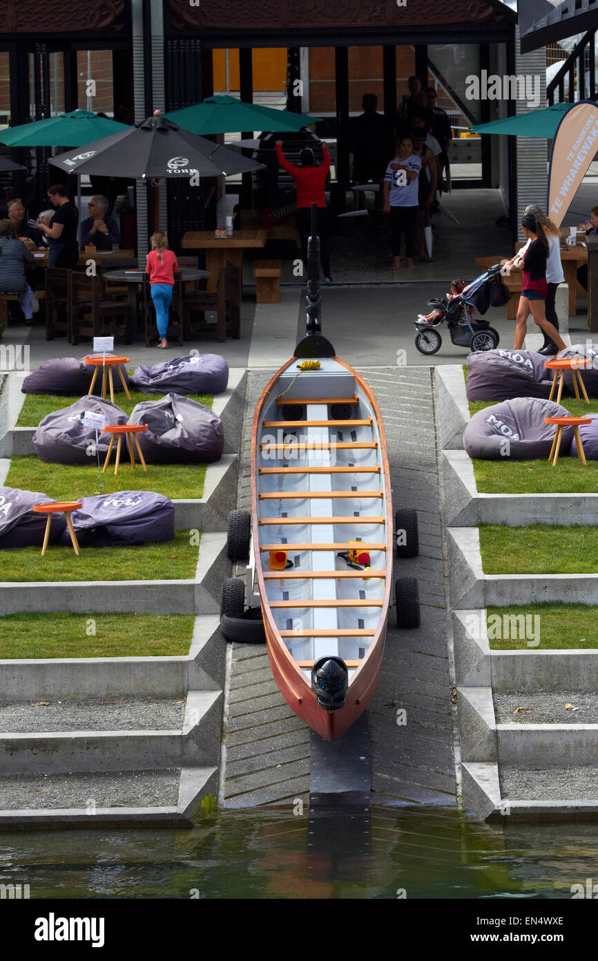 Maori Waka (boat) outside Te Wharewaka (boat house), Frank Kitts Lagoon ...