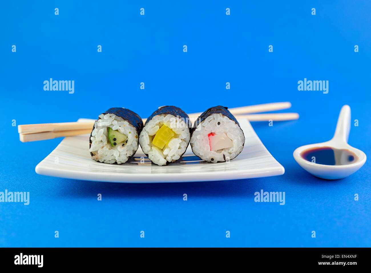 sushi three pieces with chopsticks and soy sauce Stock Photo - Alamy