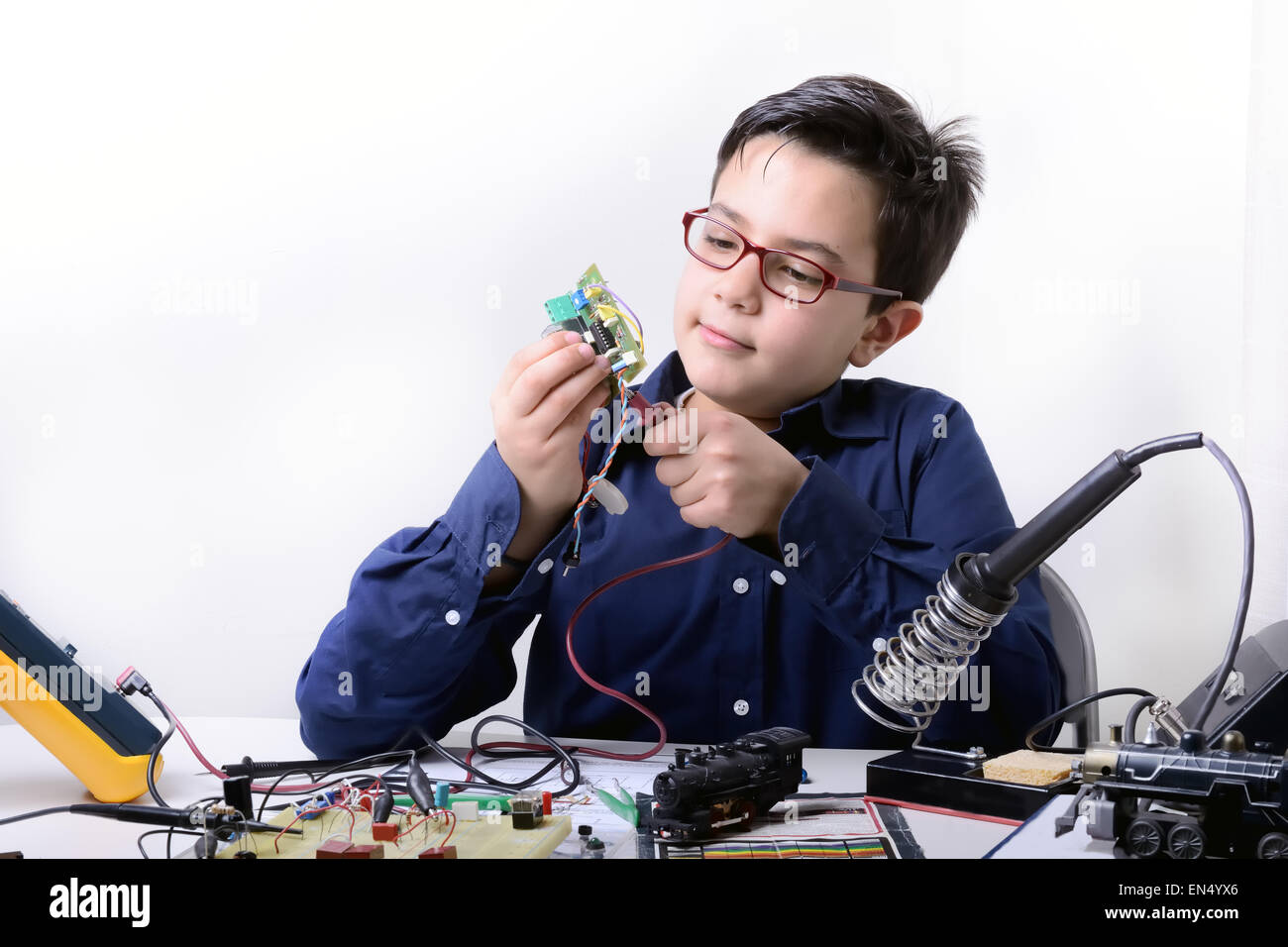 Young student performs experiments in electronics and dreams of the ...