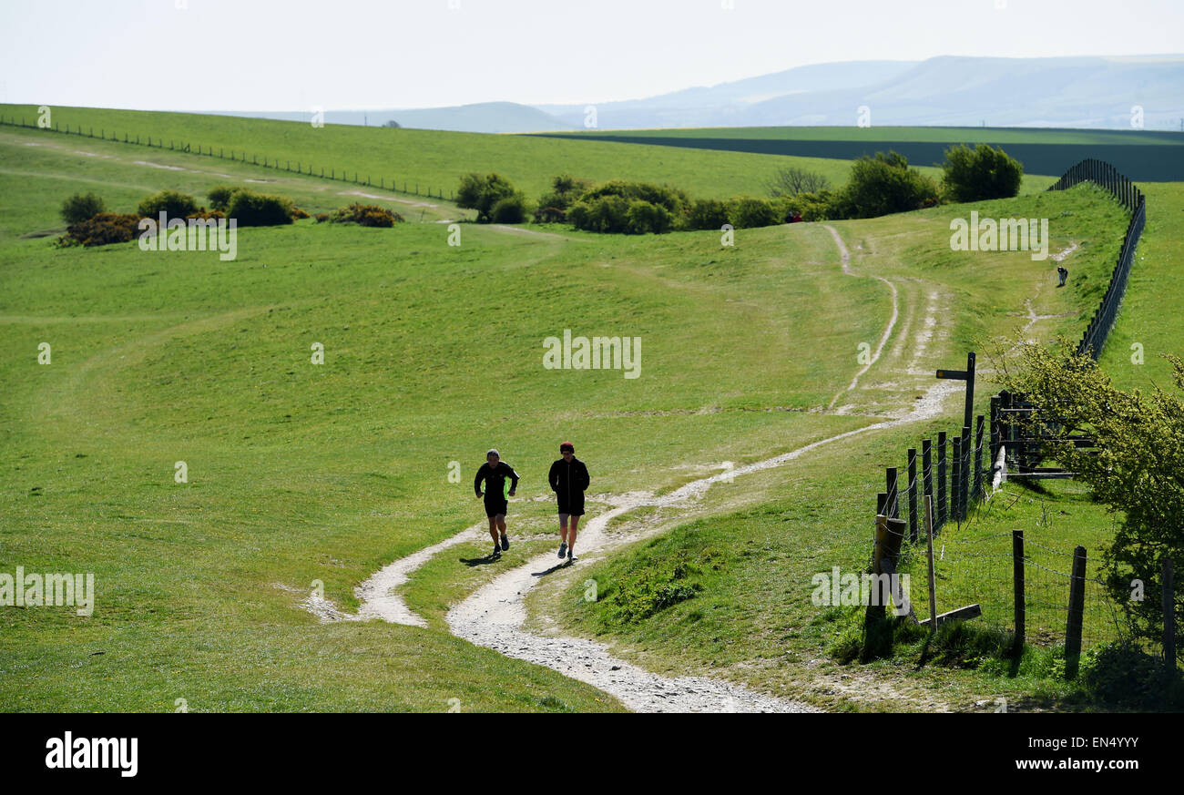 Brighton UK- Runners enjoy the sunny Spring weather on the South Downs ...