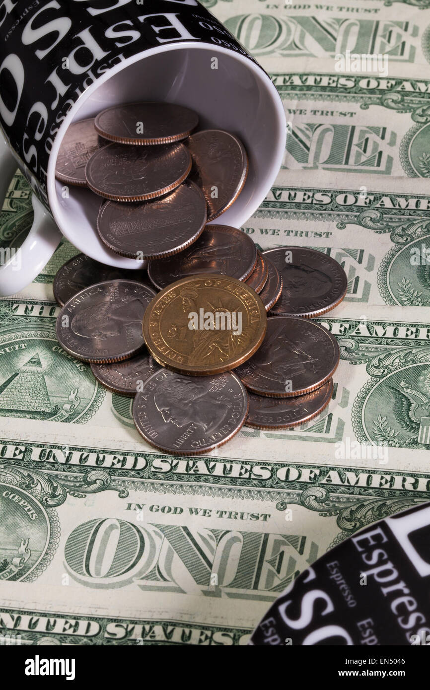 One coffee cup full of US dollars coins Stock Photo - Alamy