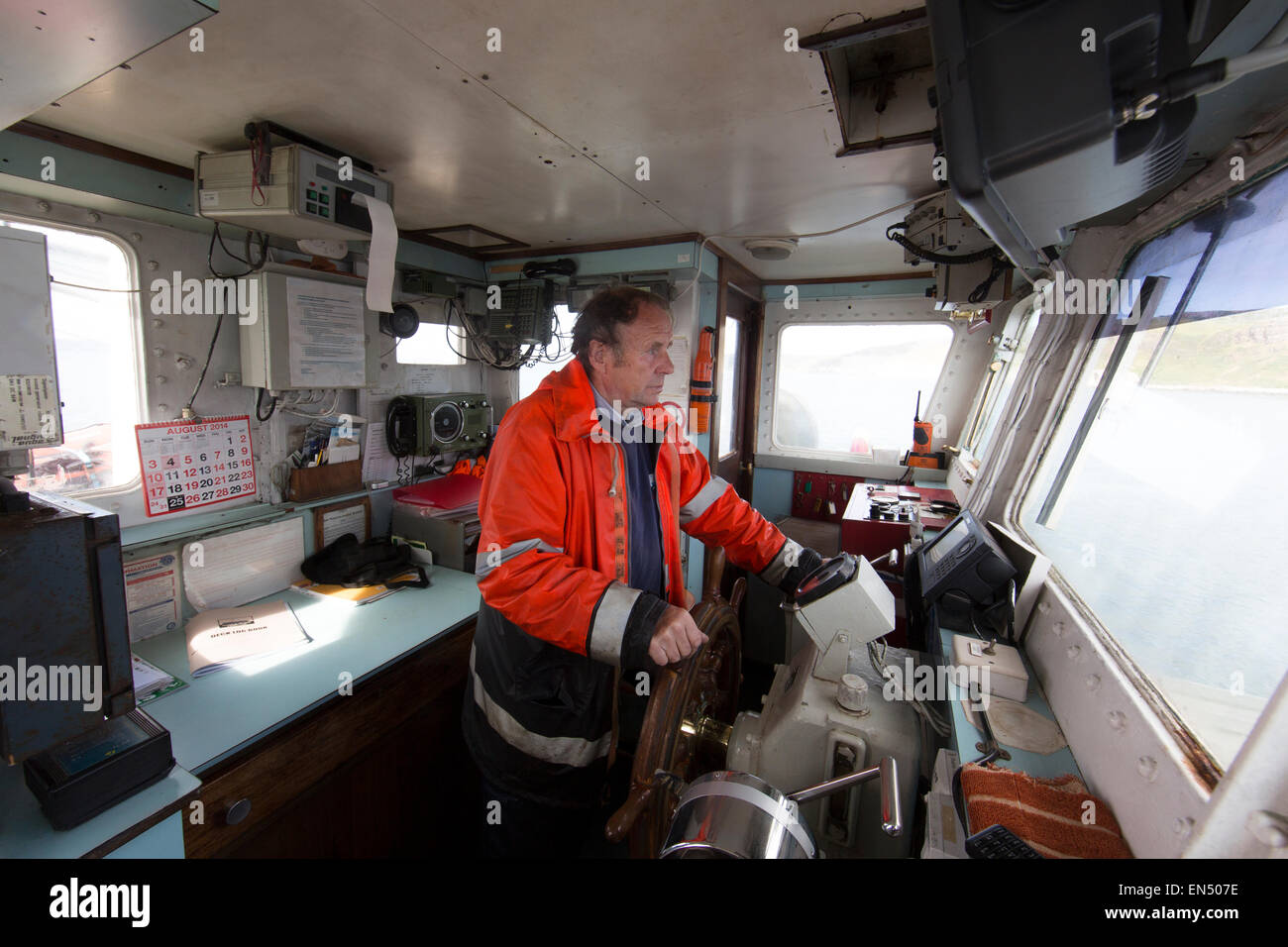 Ship captain steering boat hi-res stock photography and images - Alamy