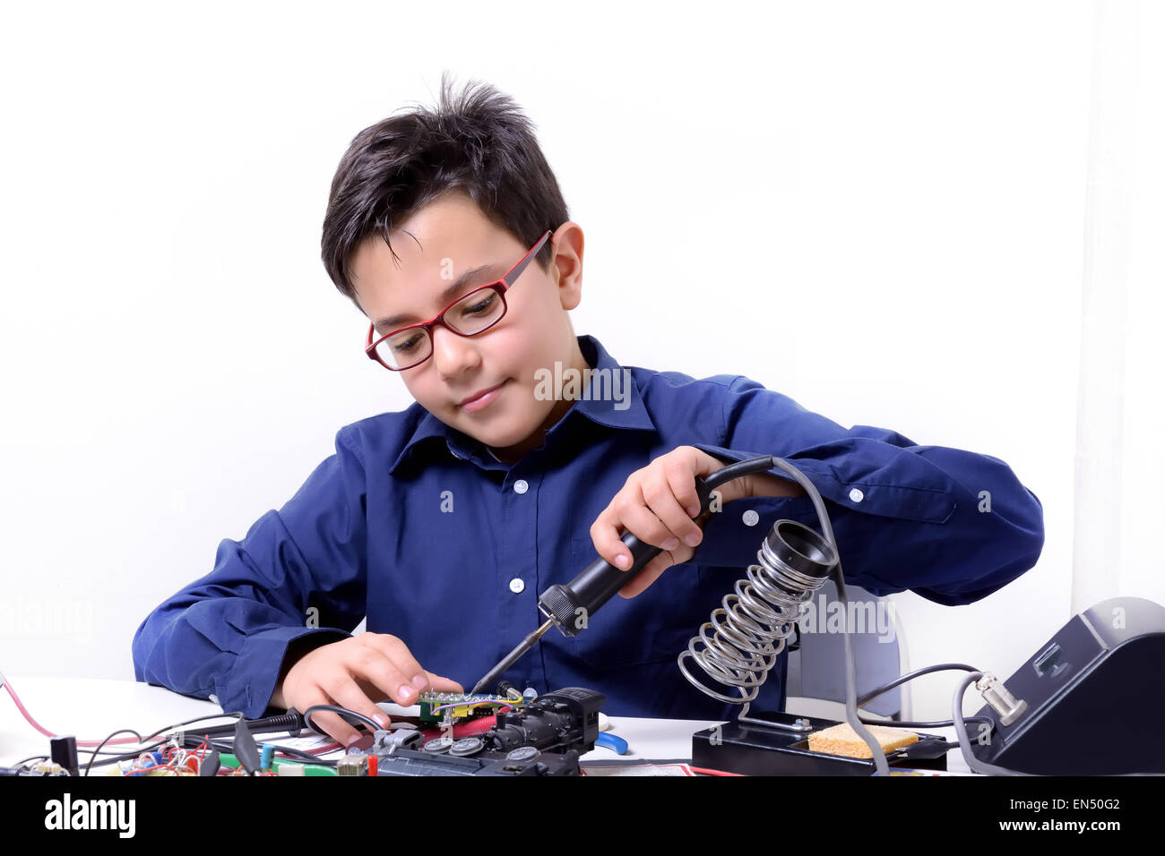 Young student performs experiments in electronics and dreams of the ...