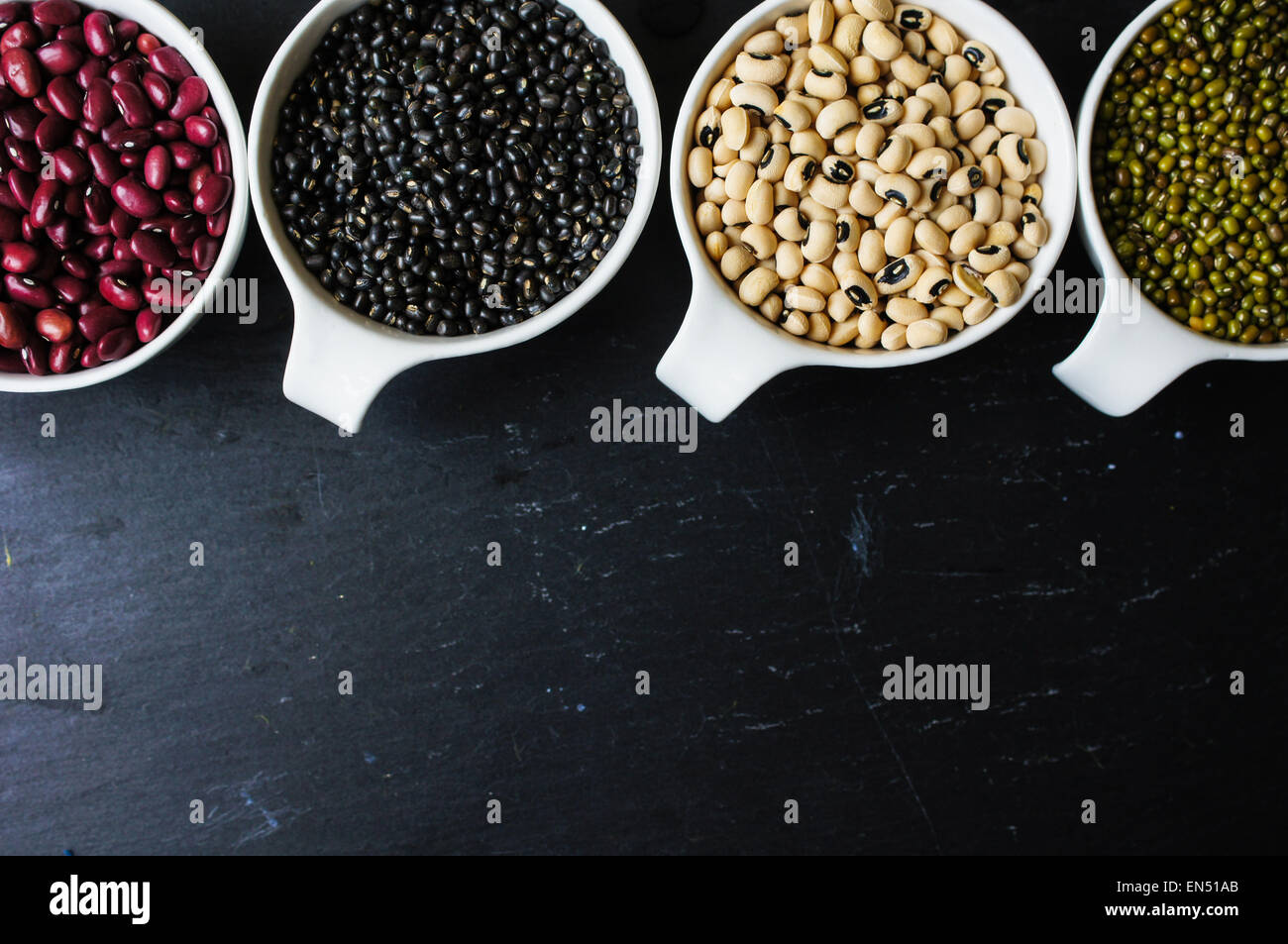 Four types of dry beans in the bowl Stock Photo - Alamy