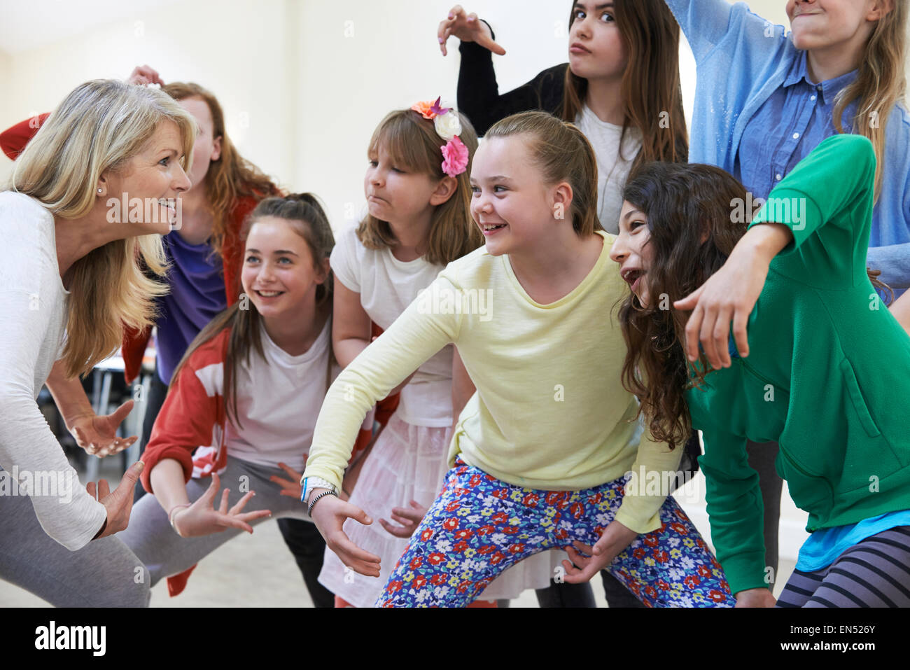 Group Of Children With Teacher Enjoying Drama Class Together Stock ...