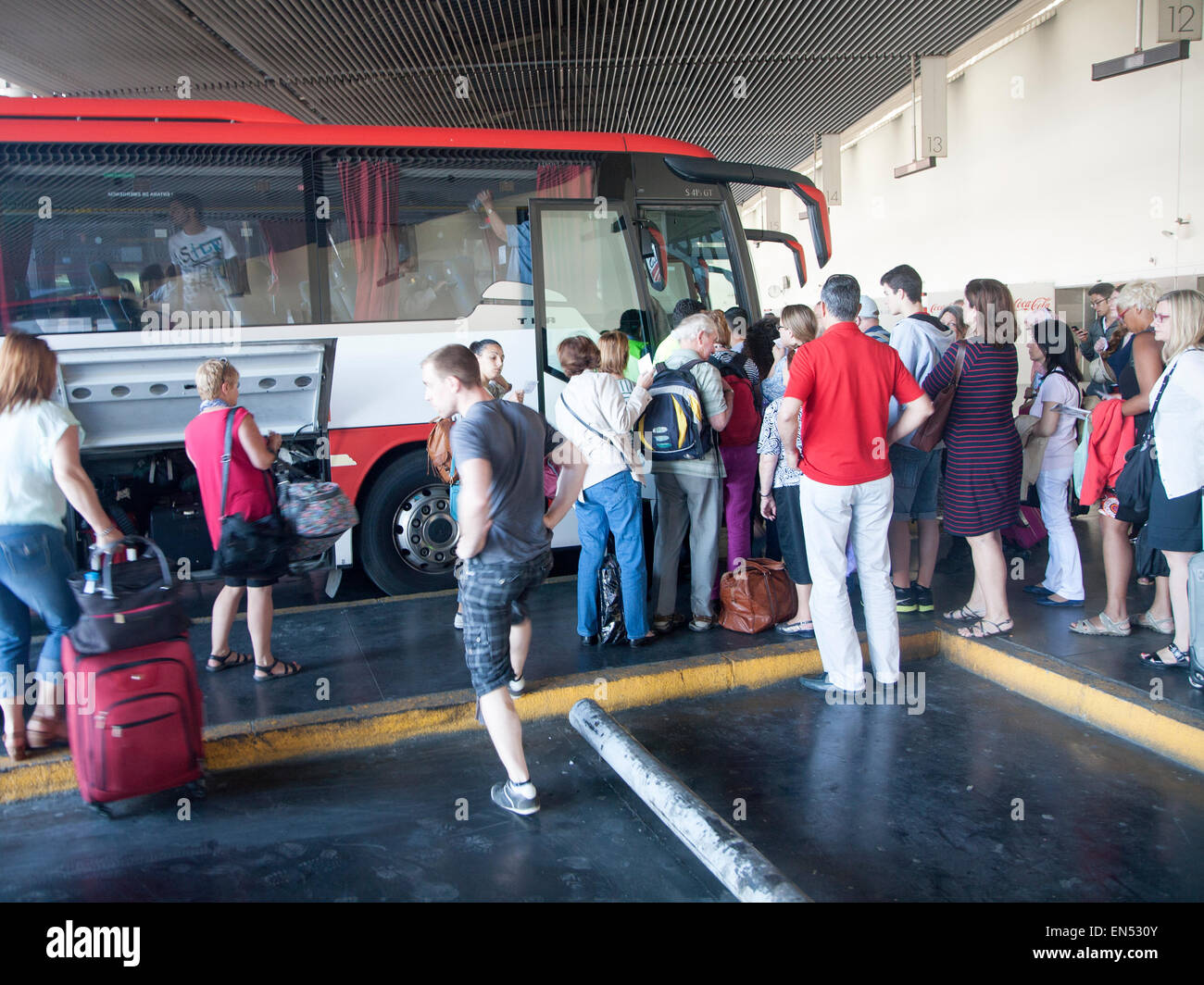 Passengers boarding long distance coach at Granada bus station, Spain ...