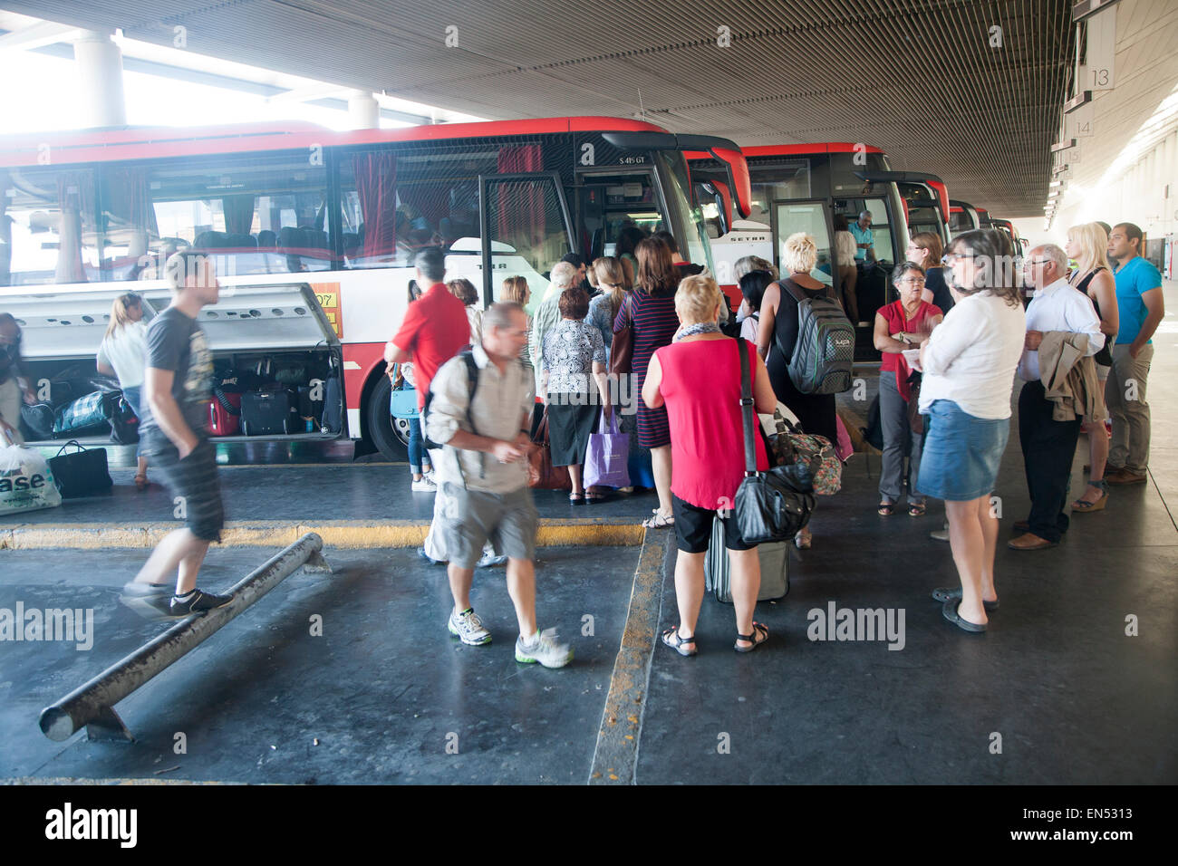 Passengers boarding long distance coach at granada bus station hi-res ...
