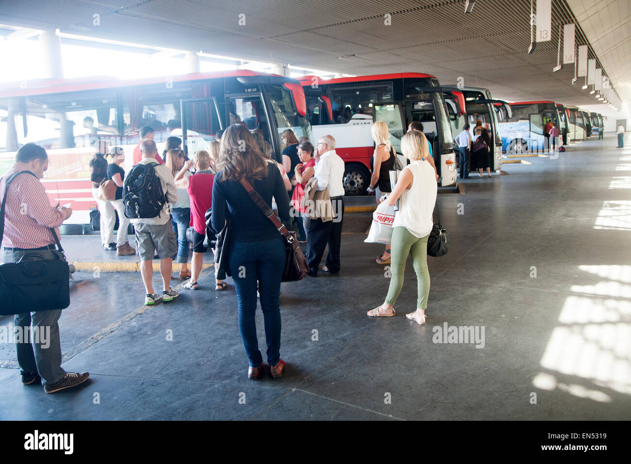 Passengers boarding long distance coach at Granada bus station, Spain ...