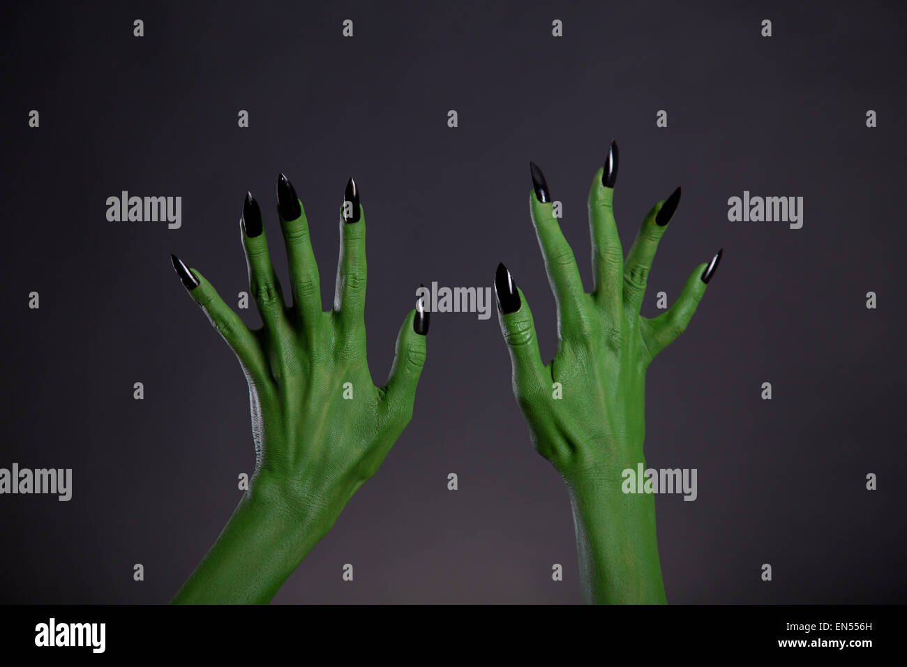 Green monster hands with sharp black nails, Halloween theme, studio ...