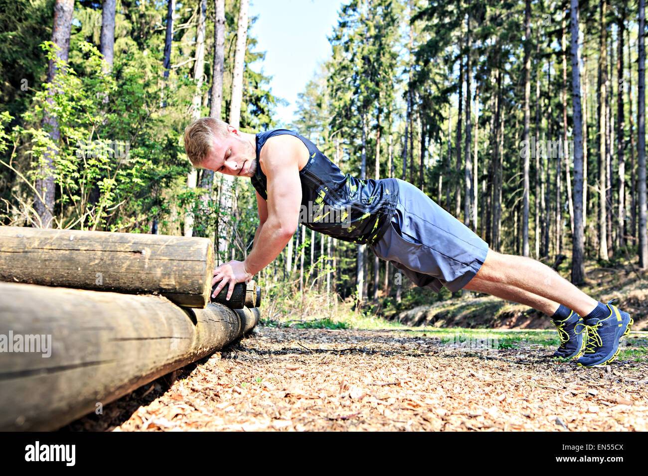 young man at training on a fitness trail Stock Photo - Alamy