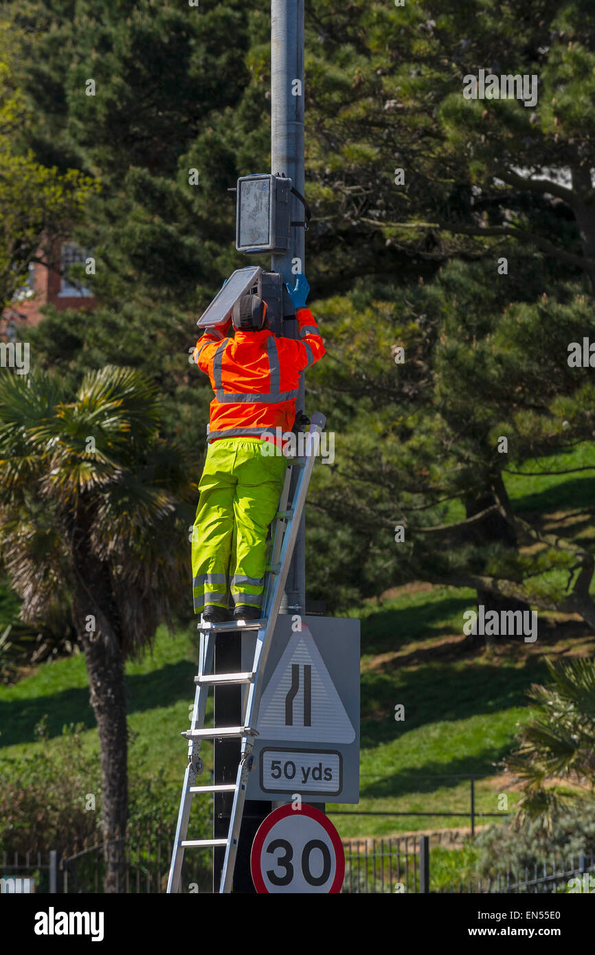 Man up ladder hi-res stock photography and images - Alamy