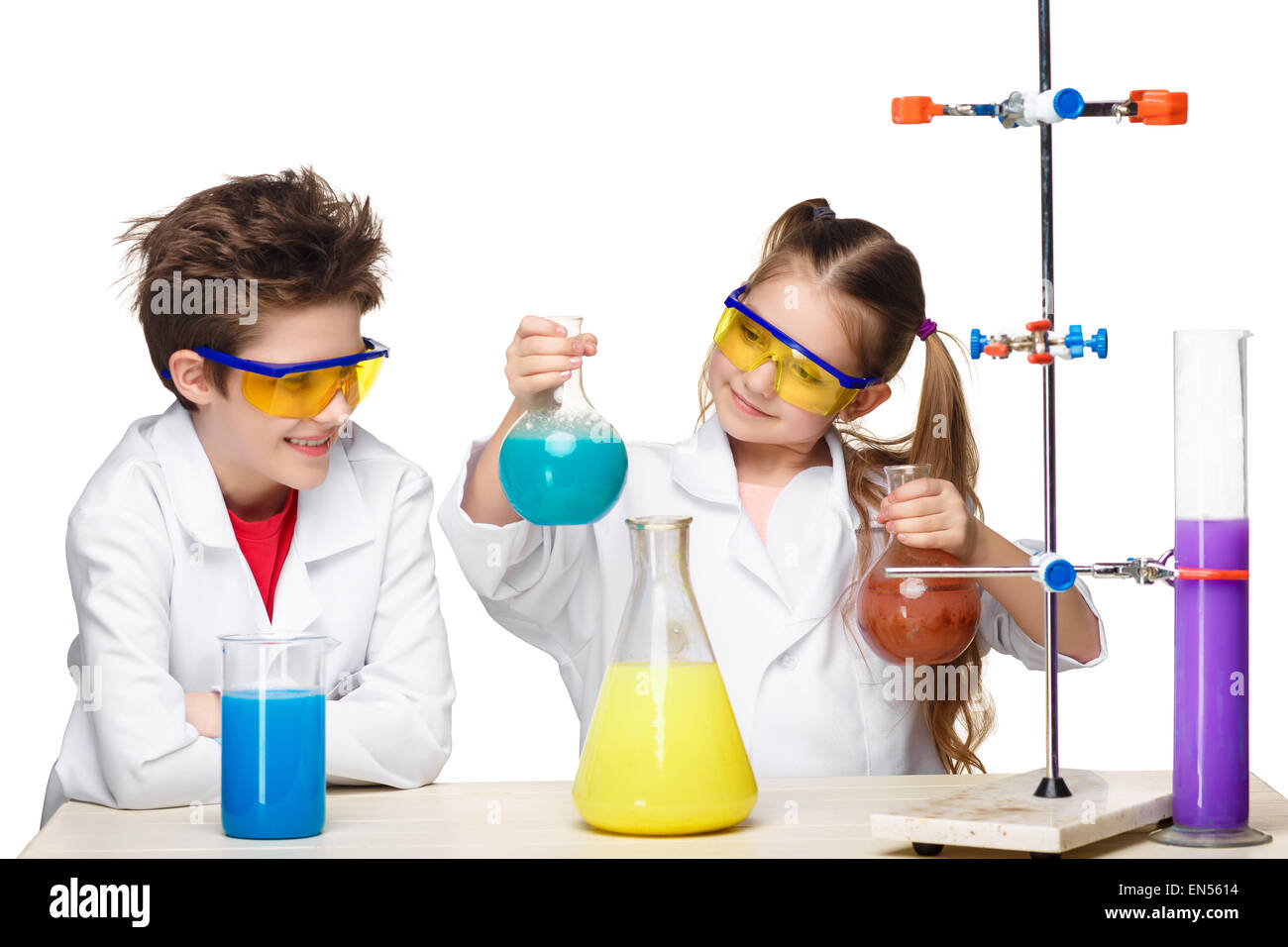 Two cute children at chemistry lesson making experiments Stock Photo ...