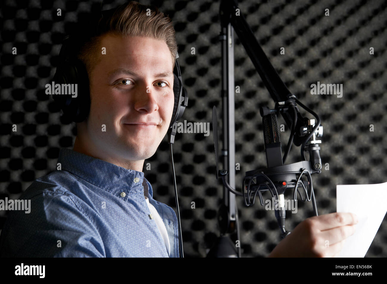 Man In Recording Studio Talking Into Microphone Stock Photo - Alamy