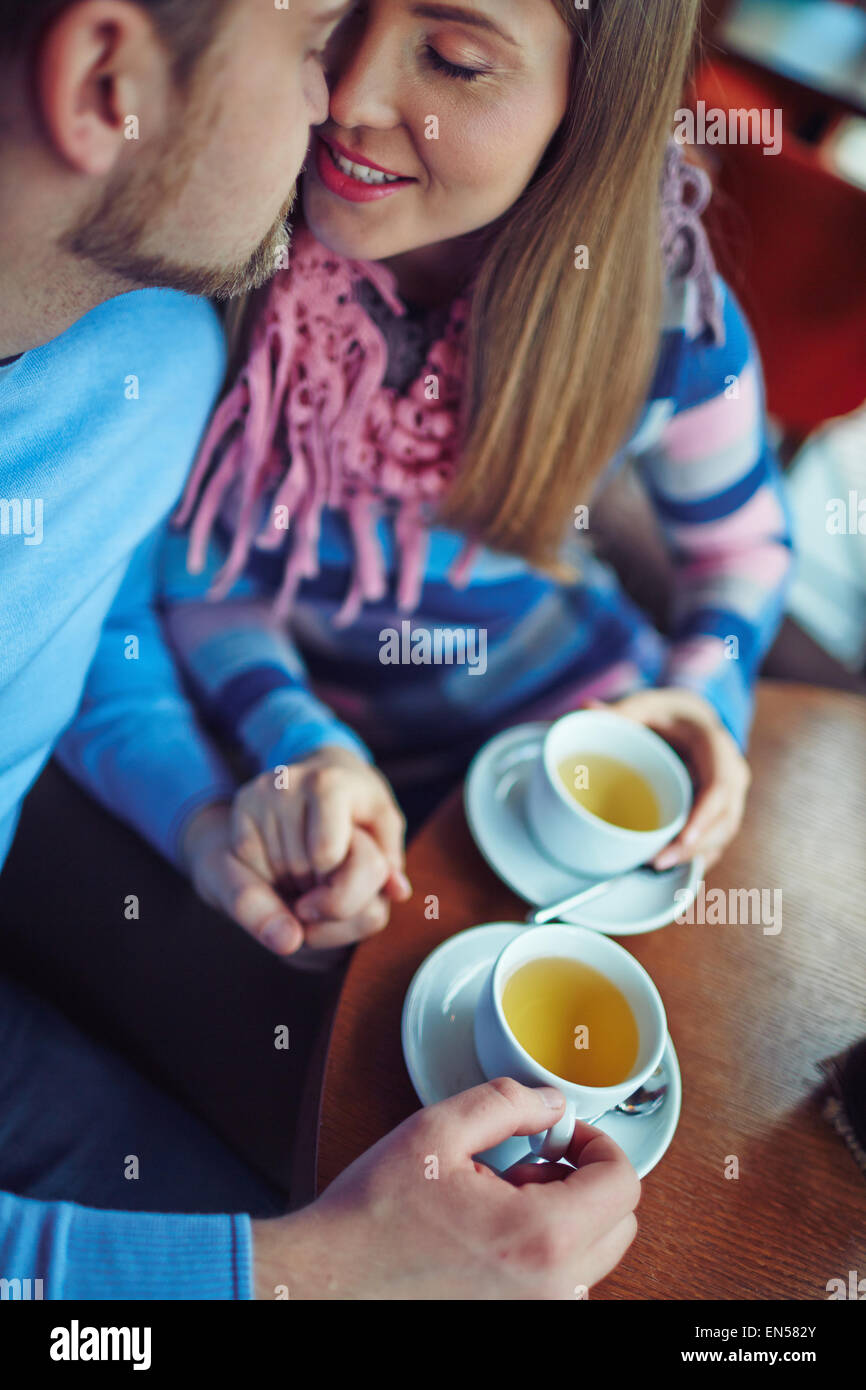 Romantic couple having tea in cafe Stock Photo - Alamy