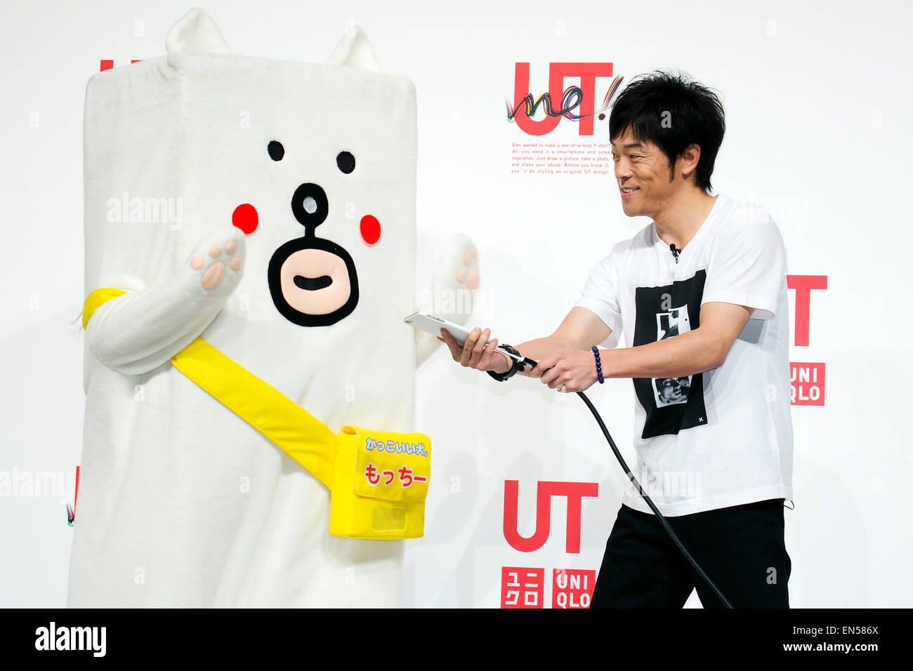 (L to R) Motchy The Kakkoi-inu character and the actor Tomonori Jinnai ...