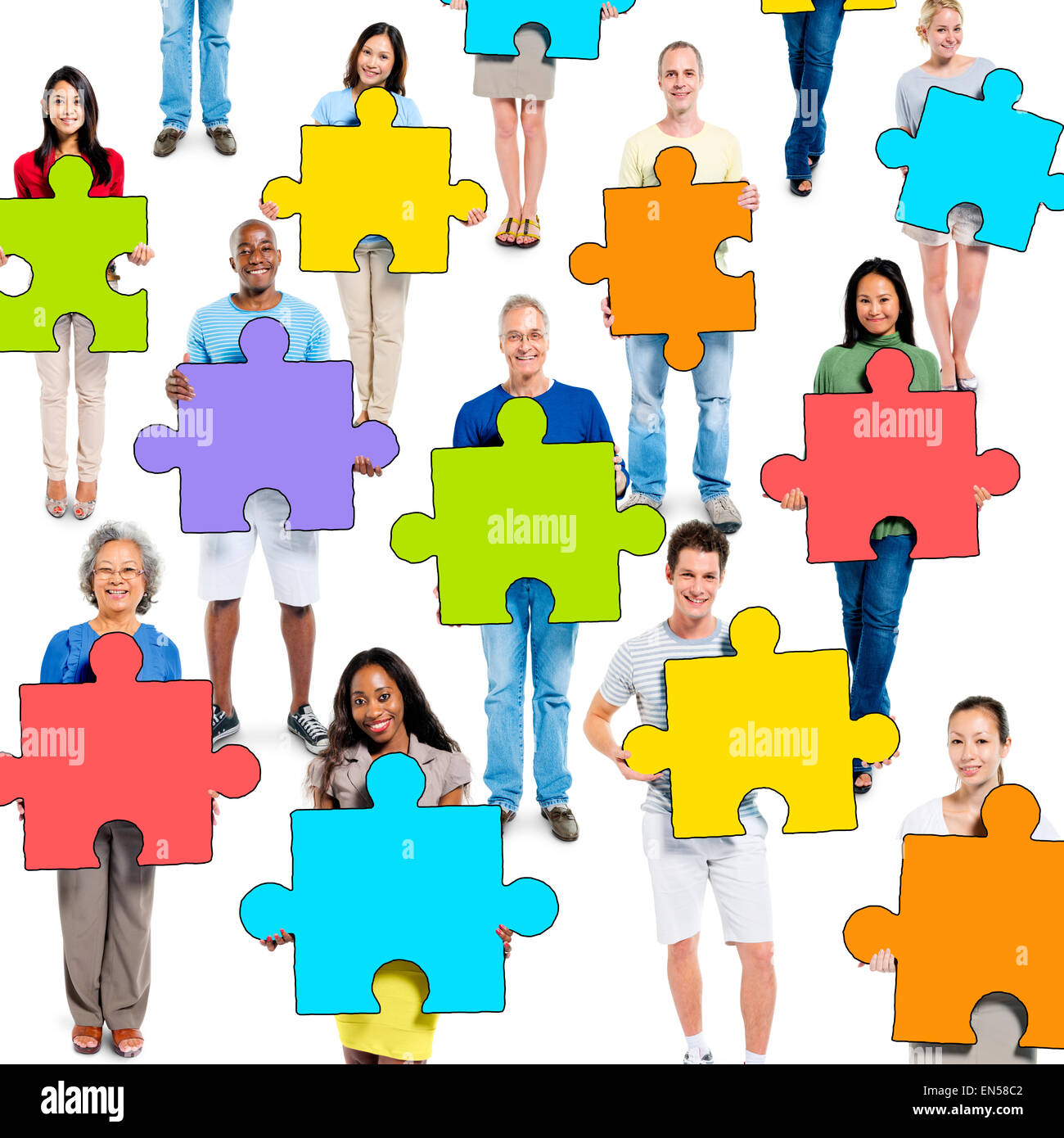 Group of People Holding Jigsaw Puzzle Piece Stock Photo - Alamy