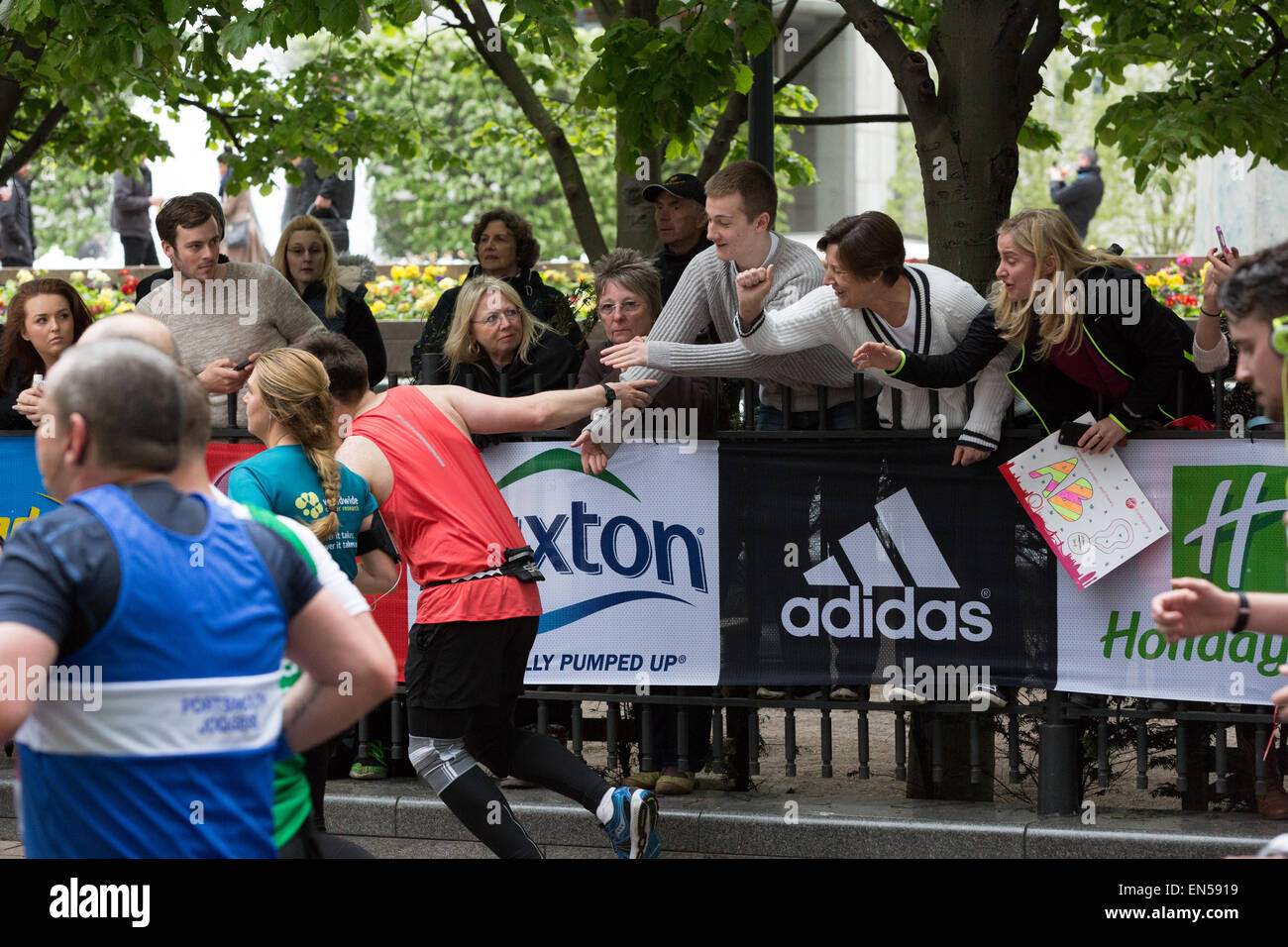 Supporters cheering and shouting at the 2015 Virgin Money London ...